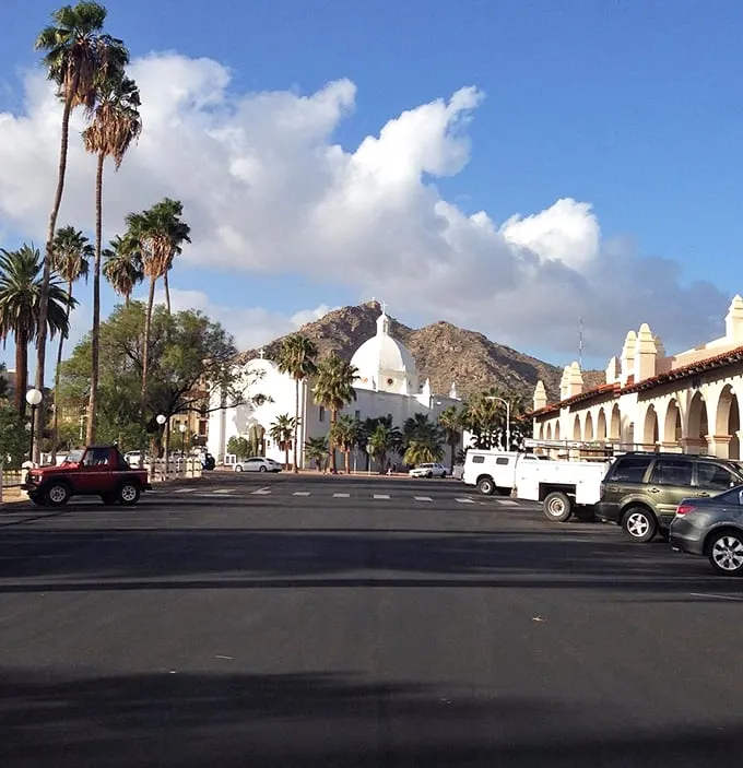 "Ajo's town square: Where Spanish charm meets Wild West grit." Palm trees and arcades create an unexpected oasis in the heart of the desert.