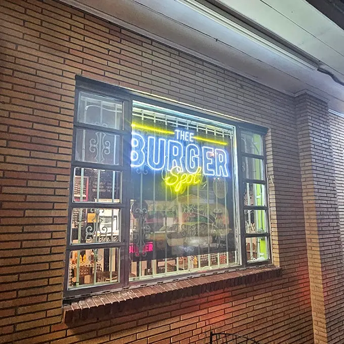 Neon dreams and burger schemes! This sign is like a beacon of hope for hungry souls in search of the perfect patty.