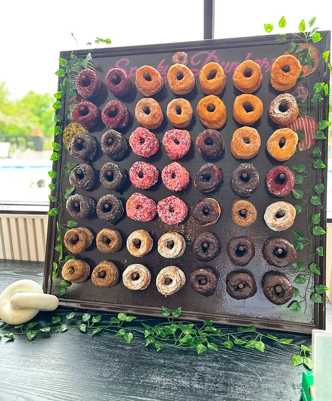 A wall of wonders! This donut display is like a delicious game of Connect Four – except every move is a winner.