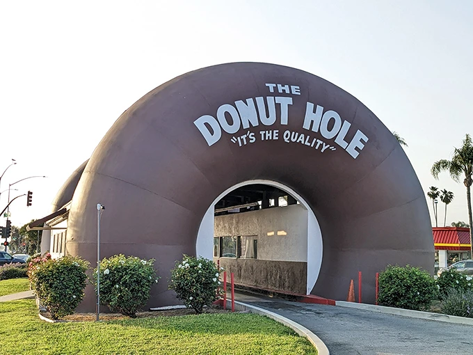 Step right up to donut nirvana! This entrance is like a portal to a world where calories don't count and sugar is a food group.