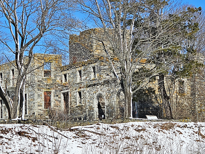 Winter's frosty fingers can't dim the allure of Goddard Mansion. Snow-dusted stones stand defiant, a chilly reminder of enduring elegance.