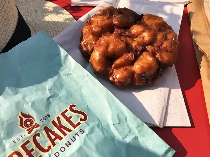 Holy fritter, Batman! This cherry-studded behemoth is not for the faint of heart – it's a superhero of sweetness.