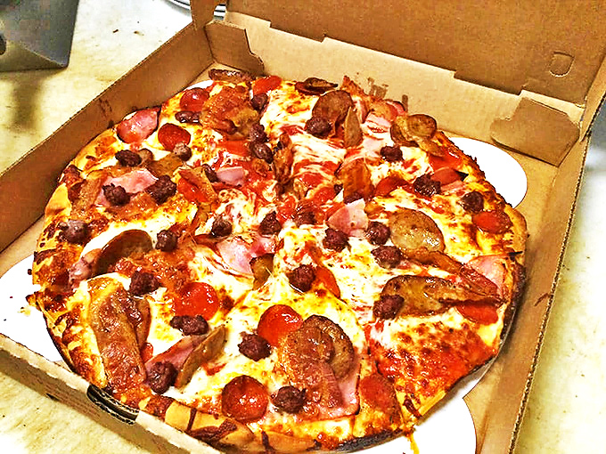 The 'kitchen sink' of pizzas – because sometimes, more is more!" This loaded pie is a testament to Pat's philosophy: why choose one topping when you can have them all?