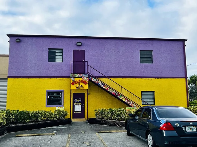 Even the parking lot screams 'fun'! It's like the building ate too much candy and couldn't contain its colorful personality.