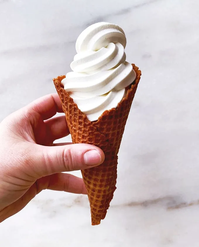 The cure for even the hottest Vermont summer day! This creemee cone is a swirly tower of maple-flavored bliss, standing tall like a delicious lighthouse.