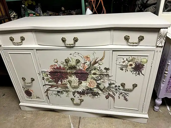 Flower power meets furniture finesse! This repainted cabinet proves that even antiques can get modern makeovers worthy of HGTV.
