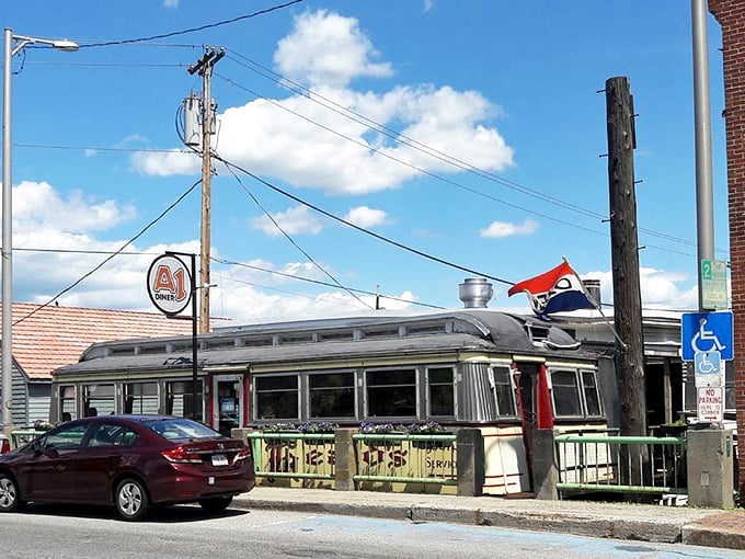 Step into a Norman Rockwell painting at A1 Diner. The neon sign beckons, promising comfort food and conversations that never go stale.