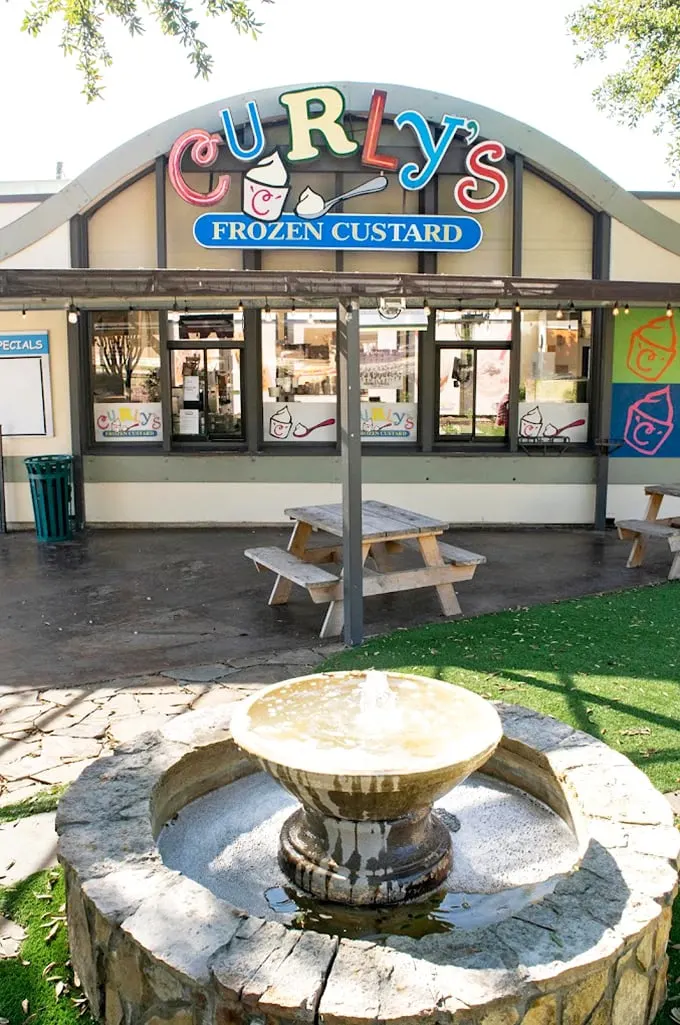 Picnic tables and pastel hues? Curly's isn't just serving custard; it's dishing out pure, unadulterated joy in Fort Worth.