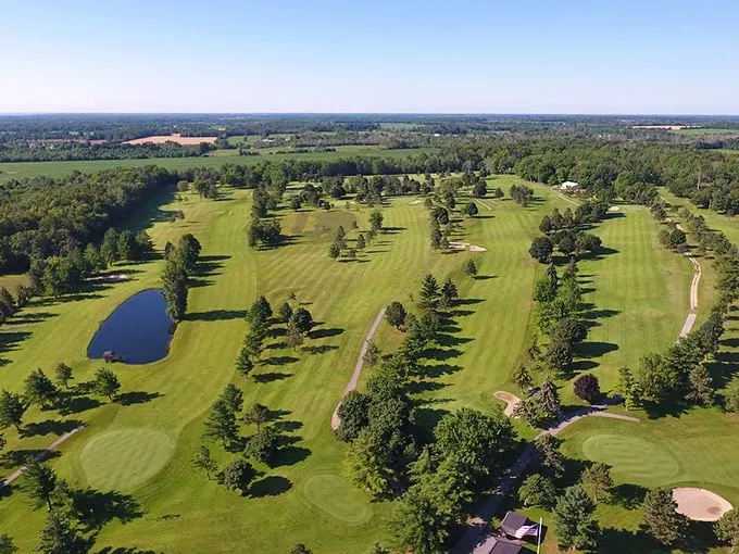Fore! This aerial view of Lexington's golf course is greener than a leprechaun's wardrobe. Tee time, anyone?