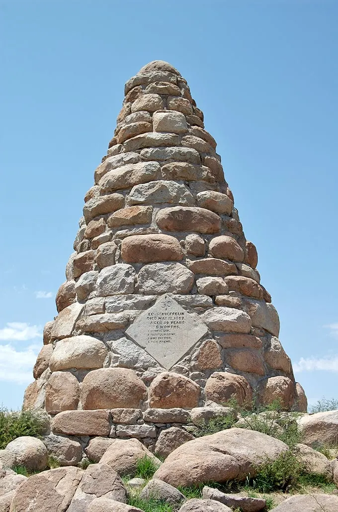 Rising like a stone sentinel against the desert sky, Ed Schieffelin's monument stands as a testament to the prospector who found silver instead of his tombstone.
