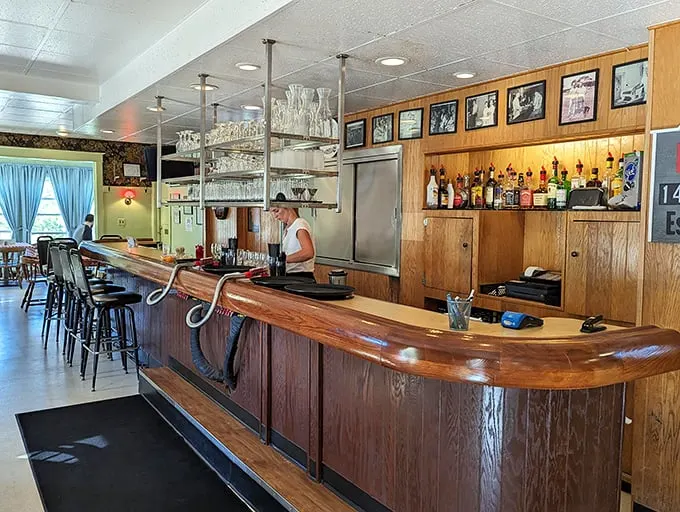 Step into a time capsule of comfort! The polished wood bar and nostalgic decor transport you to a simpler era of good food and great company.