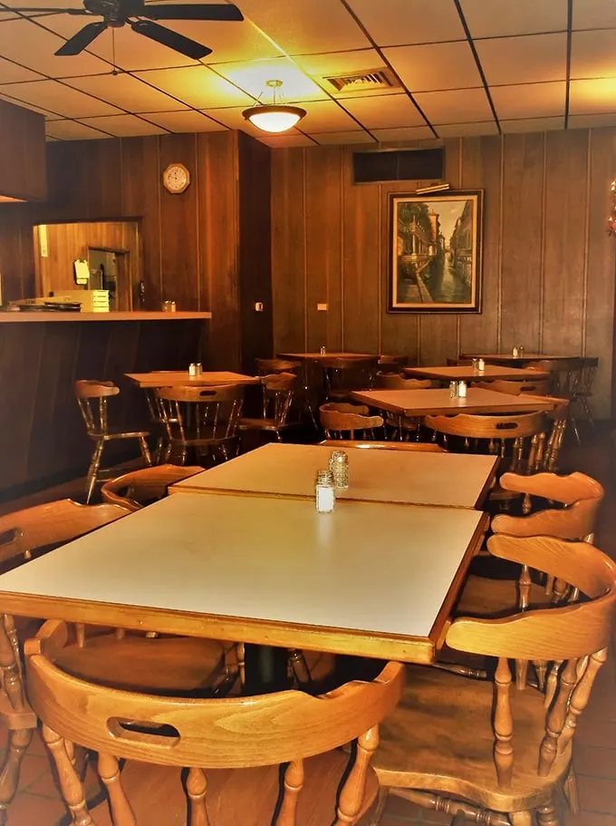 Step into a time warp of wood paneling and cozy charm. It's like your grandma's living room, but with better pizza and fewer doilies.