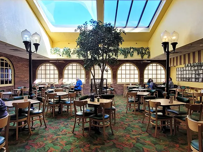 Step into a time machine of taste! This retro-chic dining room, complete with skylight and indoor tree, screams "1970s pizza party."