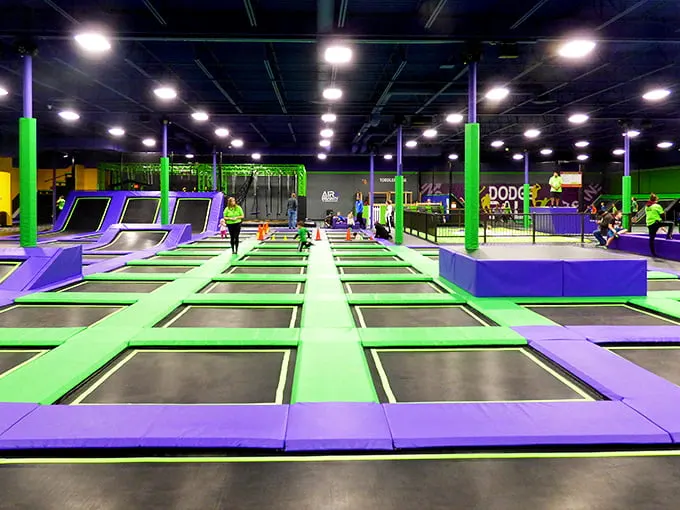 A sea of trampolines awaits, promising more ups and downs than a rollercoaster ride through puberty.