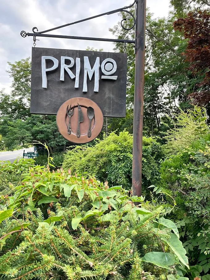 Primo's sign stands tall, a beacon for hungry travelers. It's not the yellow brick road, but it'll lead you to a gastronomic Oz.