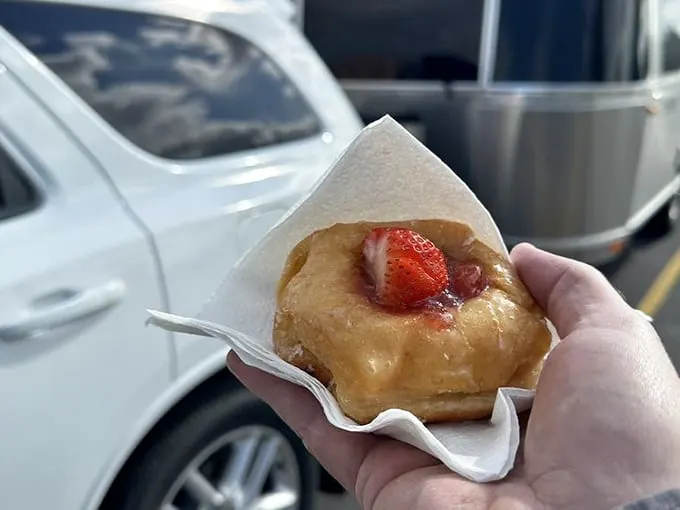 Strawberry fields forever? No, just a heavenly glazed donut crowned with nature's candy. Summer in a single bite!