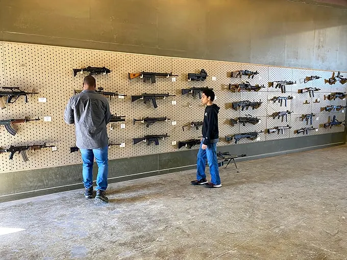 Guns, guns everywhere, but not a shot to fire... yet. This wall could make even John Wick pause and whistle in appreciation.