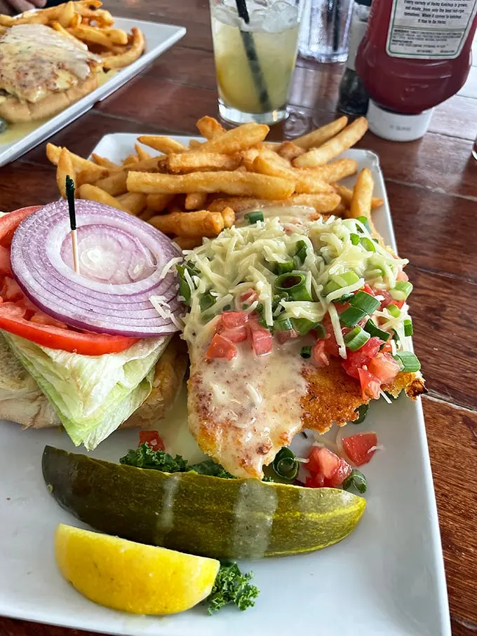 Behold, the Hogfish sandwich! It's like the Elvis of seafood - a little messy, totally indulgent, and guaranteed to leave you all shook up.