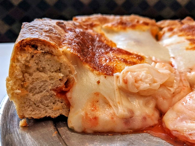 Holy moly, that's a pizza! This deep dish beauty is so packed with cheese, it could double as a life raft in Lake Michigan.