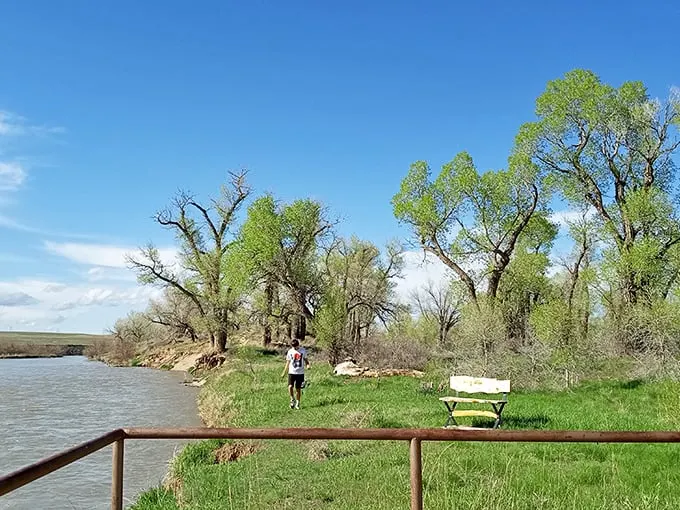 "Run, Forrest, run! This jogger's got the right idea, soaking in riverside views that'd make even Gump pause for a selfie."