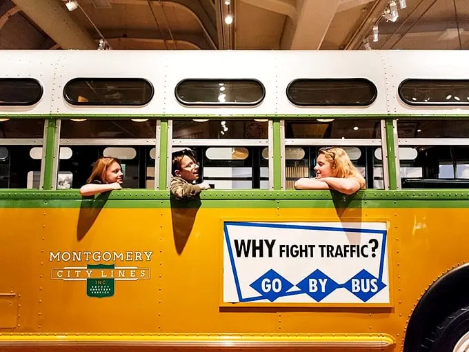 All aboard the time-traveling bus! This yellow chariot isn't fighting traffic – it's battling segregation and driving straight into the history books.