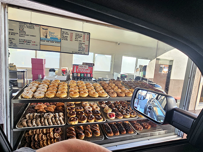Behold, a cornucopia of carbs! This display case is like a museum of edible art – if museums let you devour the exhibits.
