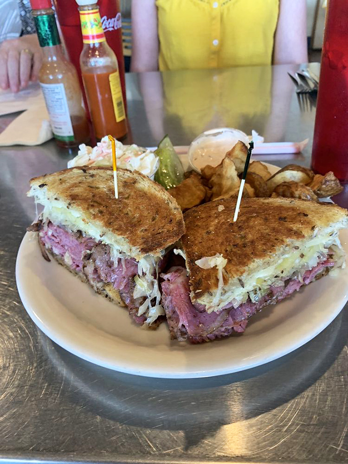 The "Perfect Reuben" lives up to its name! It's a towering testament to the art of sandwich-making. Forget the fork – you'll need a crane for this one!