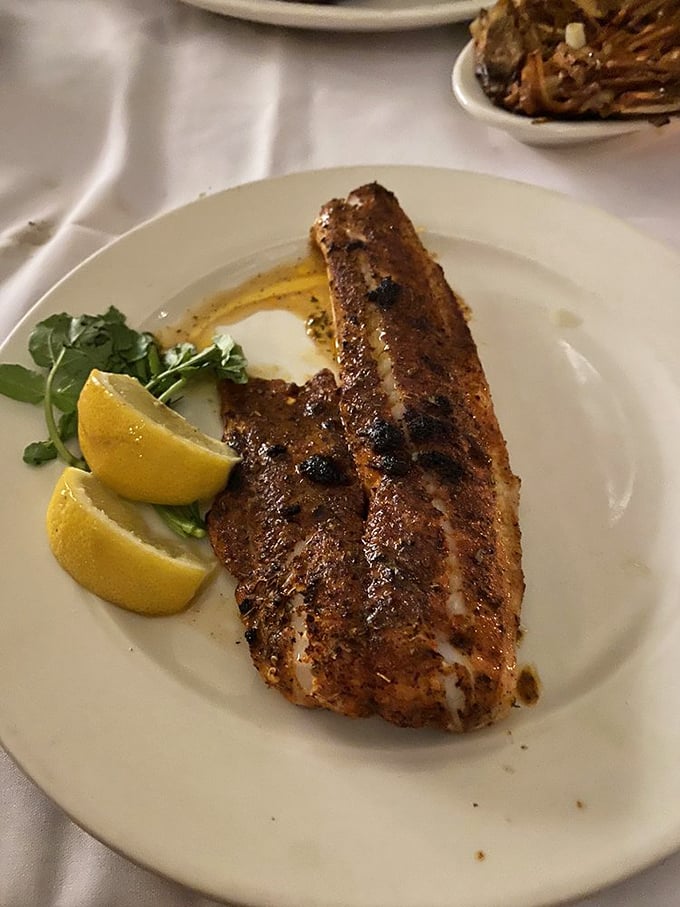 Blackened and beautiful! This walleye filet, sporting a spicy crust and zesty lemon wedges, proves that sometimes it's hip to be square (plated).