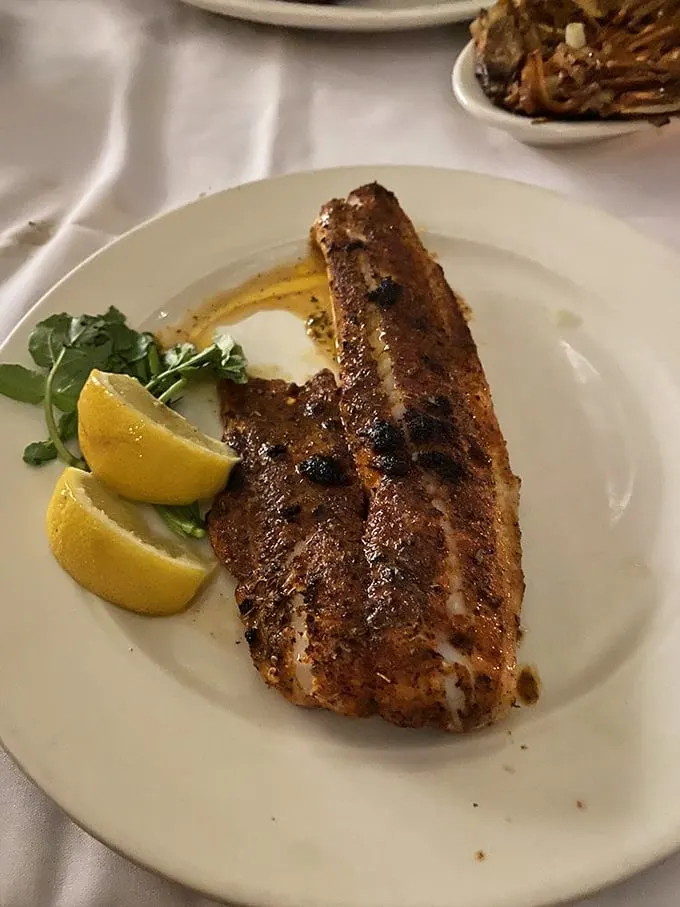 Blackened and beautiful! This walleye filet, sporting a spicy crust and zesty lemon wedges, proves that sometimes it's hip to be square (plated).