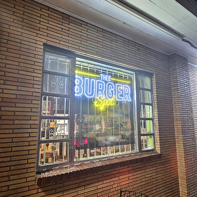 Neon dreams and burger schemes. Thee Burger Spot lights up Tampa nights with grill-fired delights.