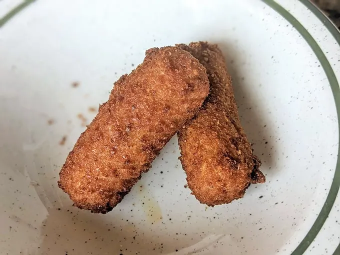 Croquetas de Jamón: Crispy on the outside, creamy on the inside. These golden nuggets are the James Bond of appetizers - dangerously smooth.
