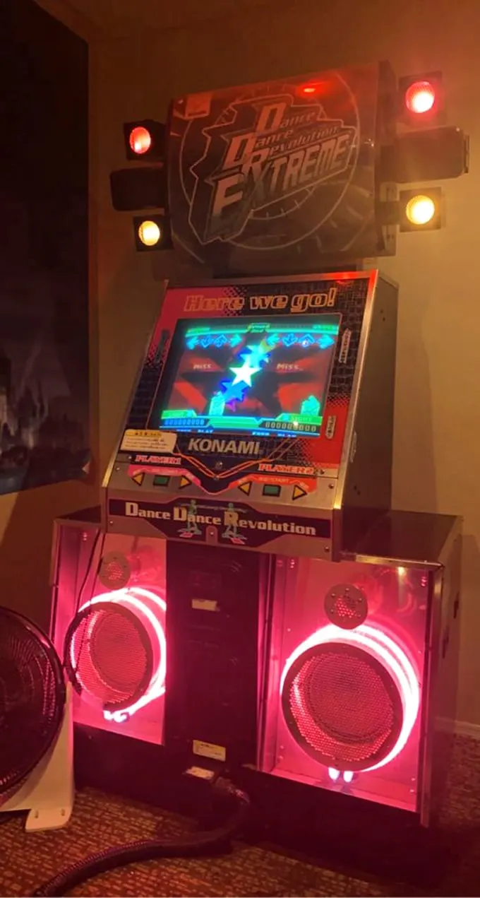Dance Dance Revolution: where rhythm meets cardio, and suddenly you're a sweaty, uncoordinated time traveler reliving your awkward teen years.