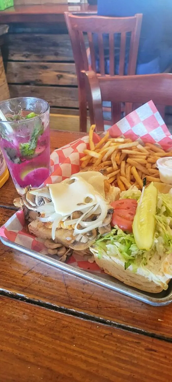 The "Killer" Hogfish Sandwich: Where seafood dreams and sandwich fantasies collide in a bun-hugging spectacle.