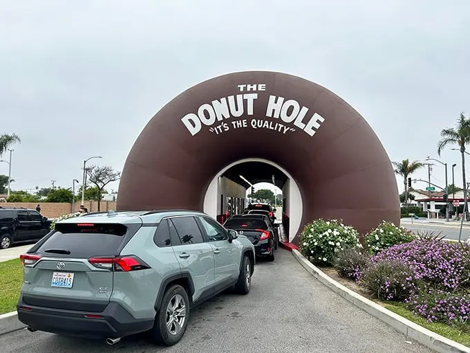 The line of cars proves the old adage: good things come to those who wait. Especially when those good things are fresh, hot donuts.
