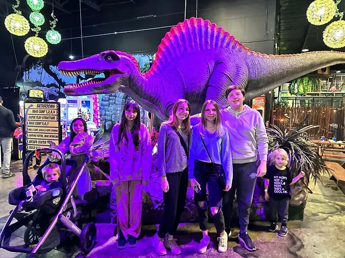 Say cheese! Or maybe, say "extinct"? This family photo op proves that dinosaurs make the ultimate prehistoric photobombers. Smile for the Cenozoic!