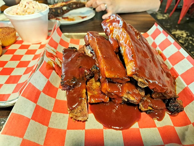 Sauce-slathered perfection! These ribs are so tender, they practically leap off the bone and into your mouth.