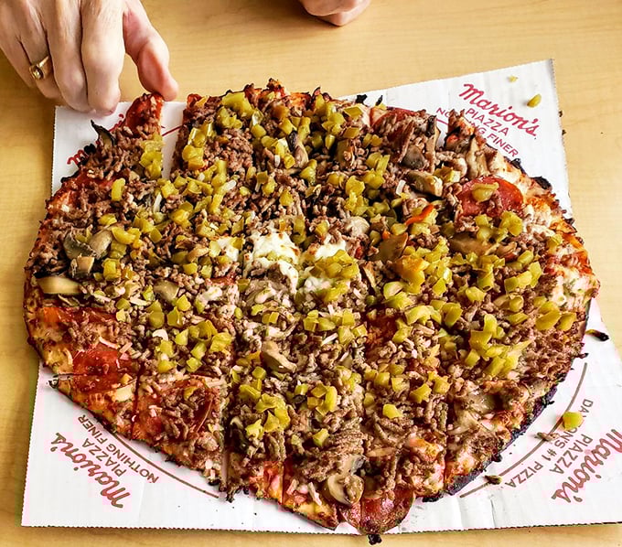 The Deluxe: where every topping is the star! It's like the Avengers of pizzas – each bite a superhero team-up of flavors.