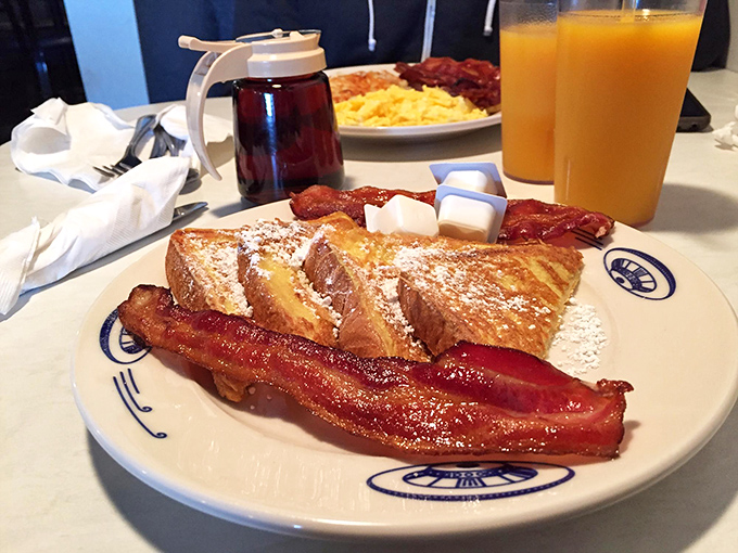 French toast that's golden brown and out of this world! Paired with bacon strips that could double as fuel rods for your interstellar journey.