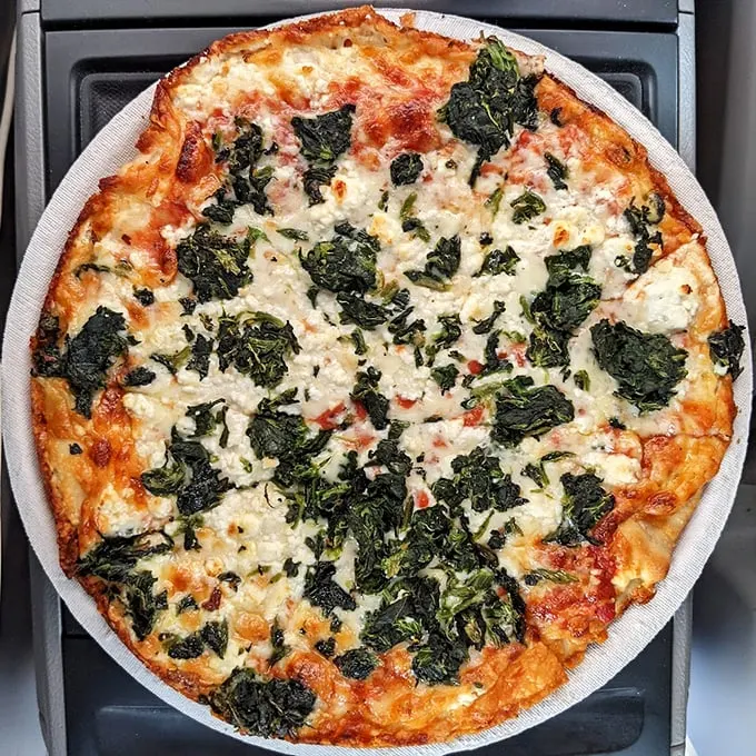 A Greek-style pizza that would make Zeus himself descend from Mount Olympus. Opa! That's a lot of toppings!