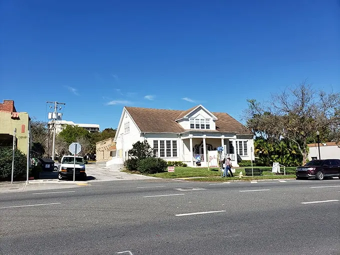 Neighborhood watch: A quaint white house keeps a watchful eye on Dade City's streets, probably gossiping with the neighboring palms.