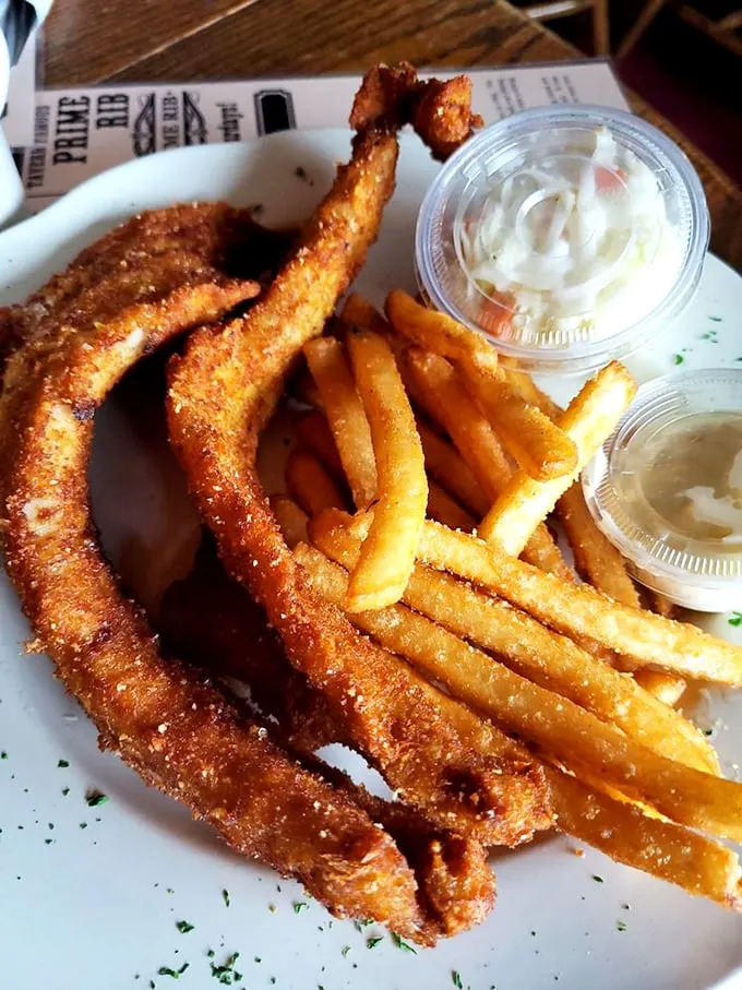 Crispy on the outside, tender on the inside – this fish is having its very own red carpet moment. And those fries? The perfect co-stars.