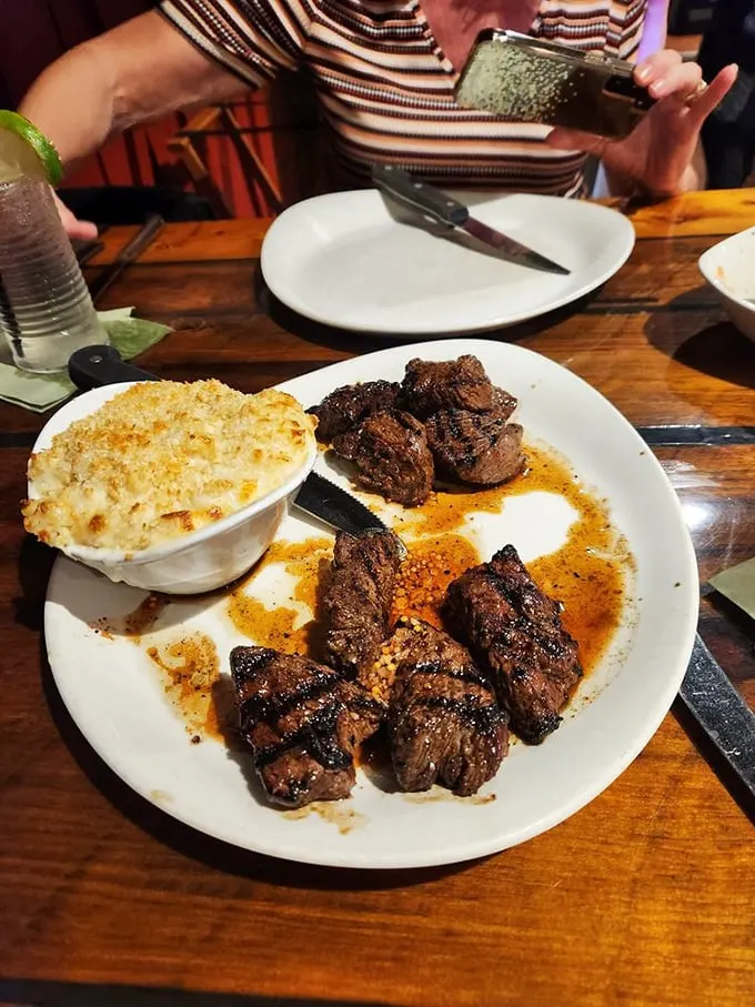 Steak tips and mac & cheese: the dynamic duo of comfort food. It's like a warm hug for your stomach.