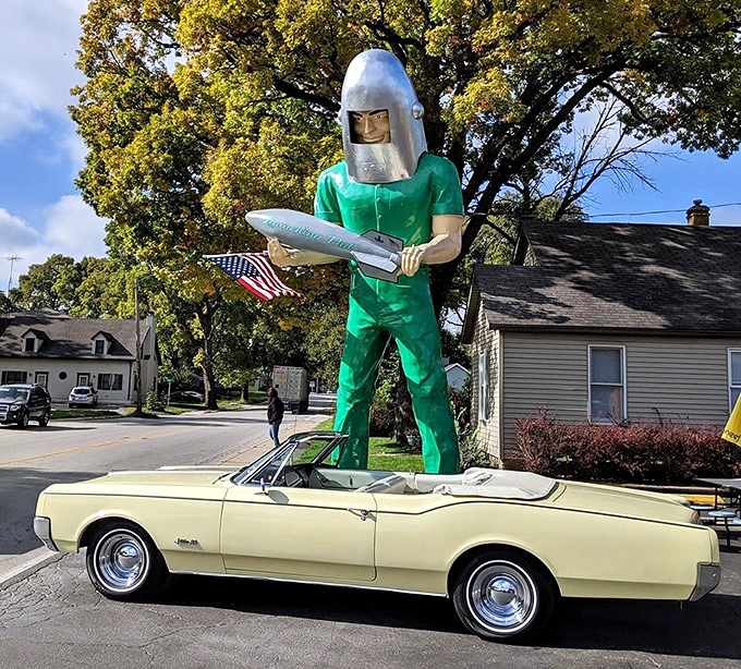 Classic car meets cosmic colossus – it's like "American Graffiti" got a reboot from Stanley Kubrick. Now that's what I call a space race!