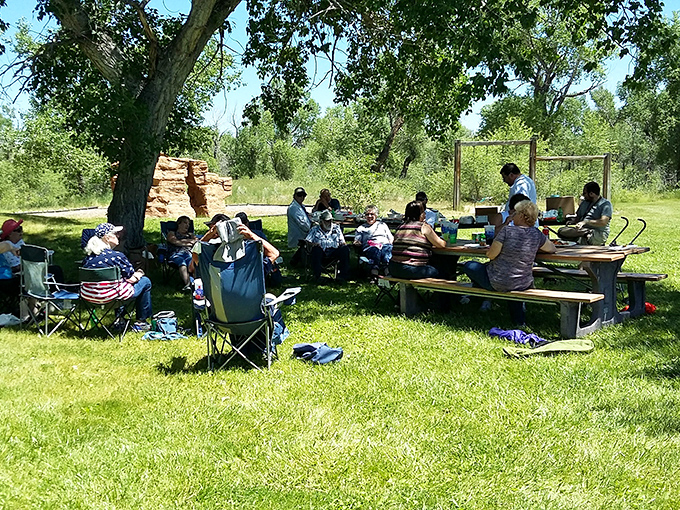 "Picnic perfection! These folks have mastered the art of outdoor dining – no reservations required, just good company and great views."