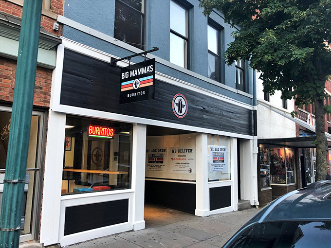 Sleek black and white storefront – it's like BBQ got a makeover from Queer Eye, but kept its saucy personality.