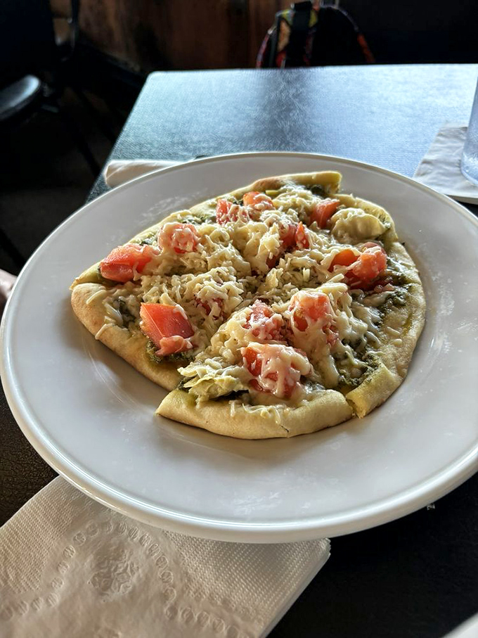 Who needs New York pizza when you've got this veggie-loaded beauty? It's like a garden party on a crispy crust.
