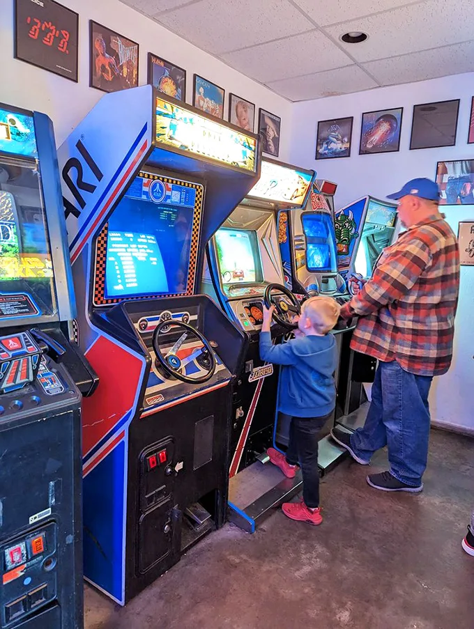 Grandpa's showing junior the ropes of road racing. It's heartwarming to see family bonding over virtual speed – no driver's license required!