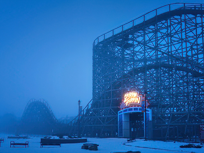 Even in winter's embrace, this coaster stands ready. It's like the postal service of thrill rides – neither snow nor rain shall stop it.