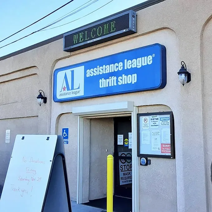 Assistance League: Where shopping sprees and good deeds collide! This cheery storefront promises treasures for every generation.