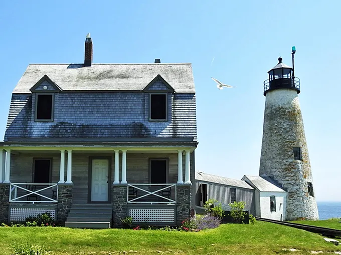 Wood Island Lighthouse: Where history and mystery collide. It's like a maritime soap opera set in stone.